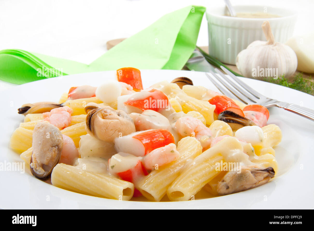 Plate with italian pasta with fruit de mer Stock Photo - Alamy