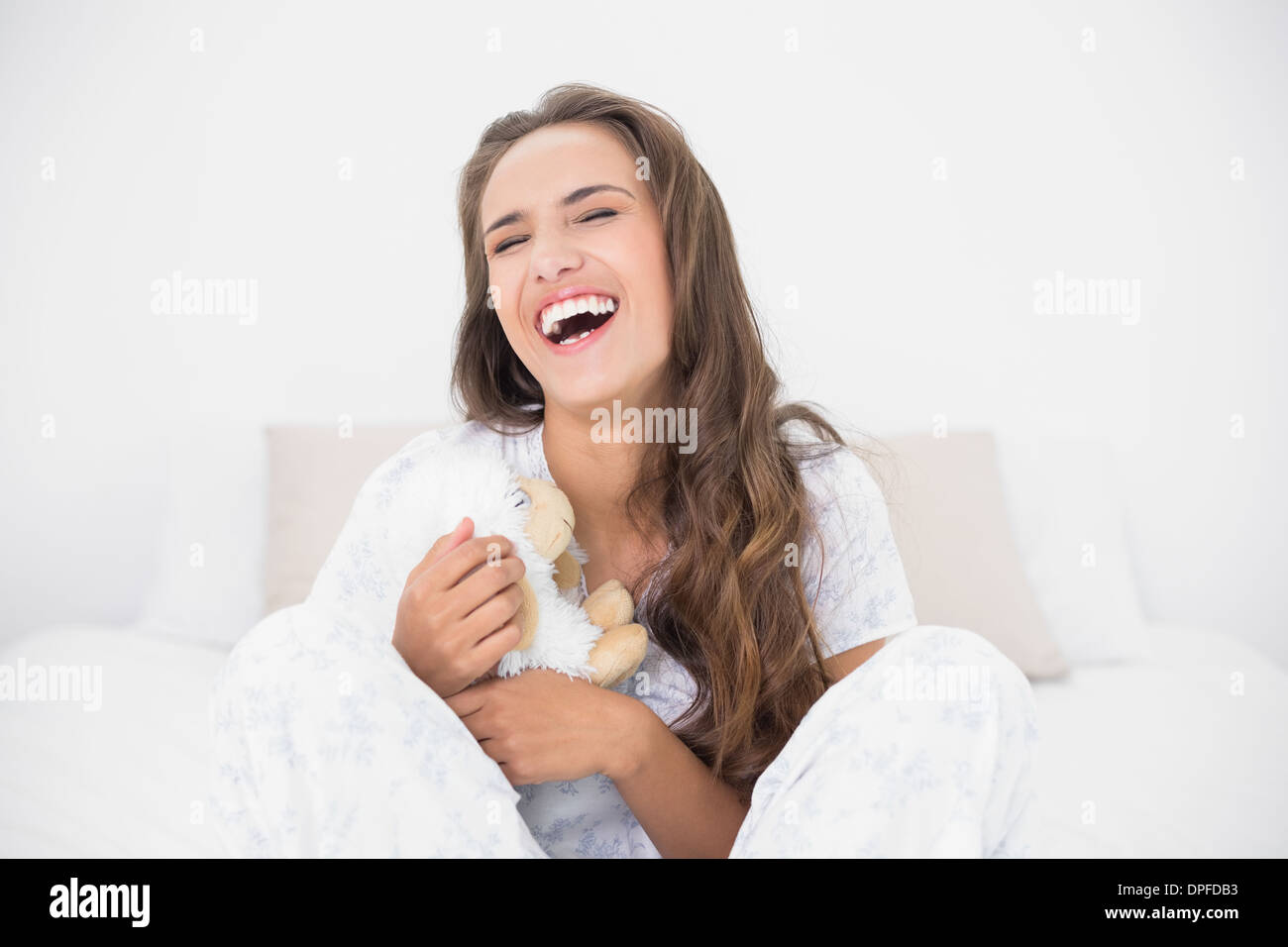 Cuddling a soft toy hi-res stock photography and images - Alamy