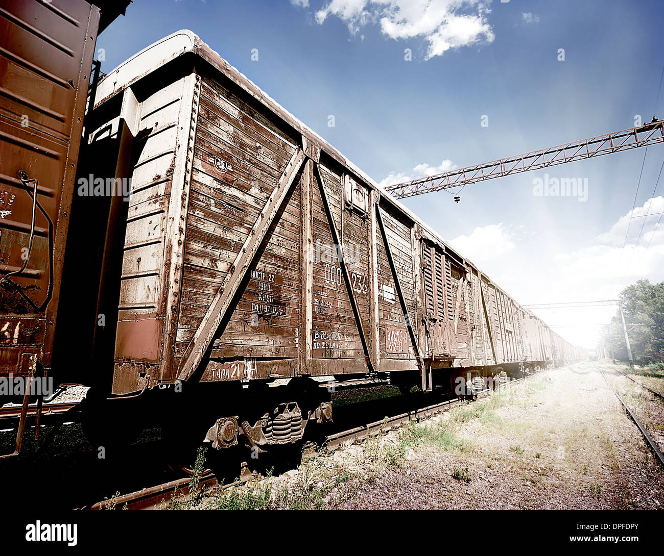 Cars of freight train going to horizon Stock Photo - Alamy