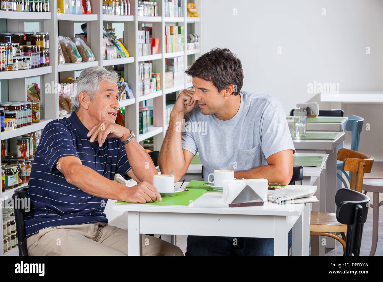 Father And Son Discussing Over Coffee Stock Photo - Alamy