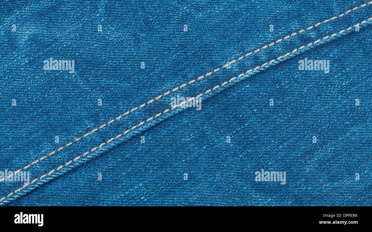 Denim background with a diagonal seam through it Stock Photo - Alamy