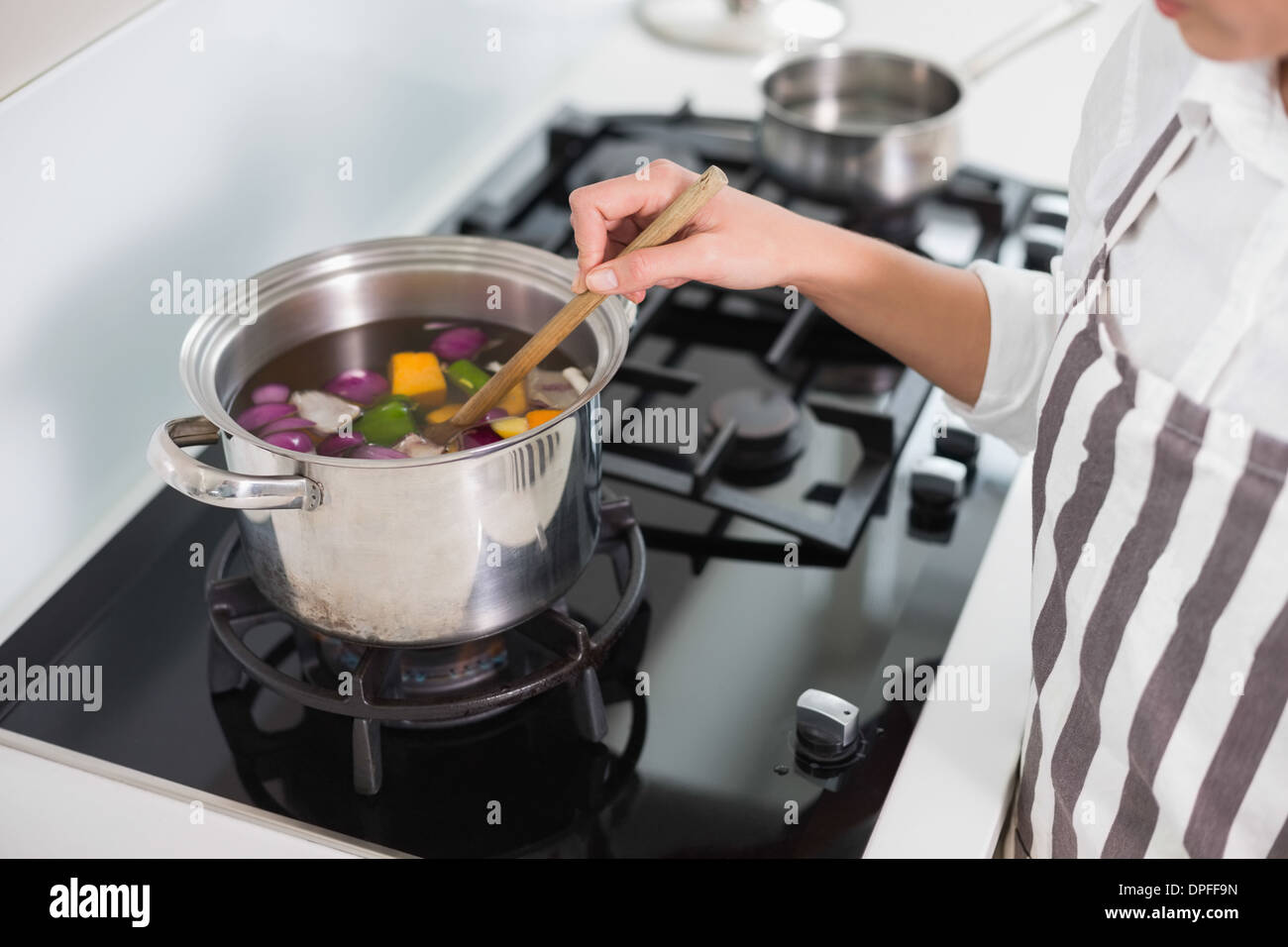 Wooden spoon mixing pot hi-res stock photography and images - Alamy