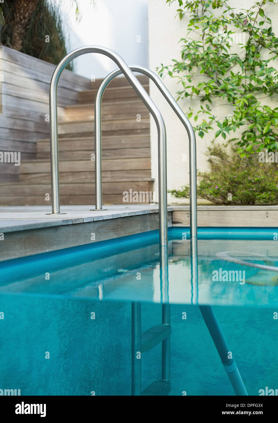 Metal ladder in a swimming pool Stock Photo - Alamy
