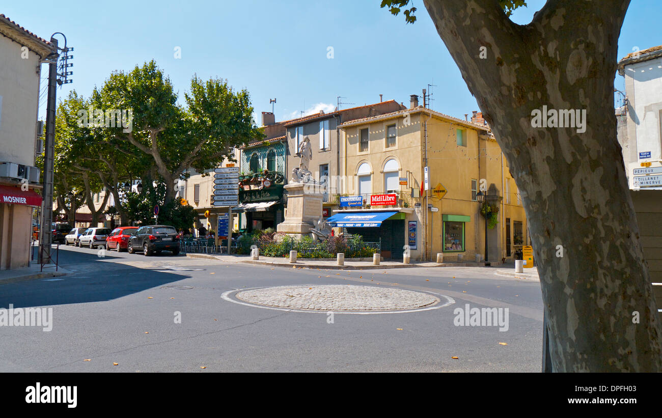 The war memorial in the town centre, on a sunny day in Olonzac ...