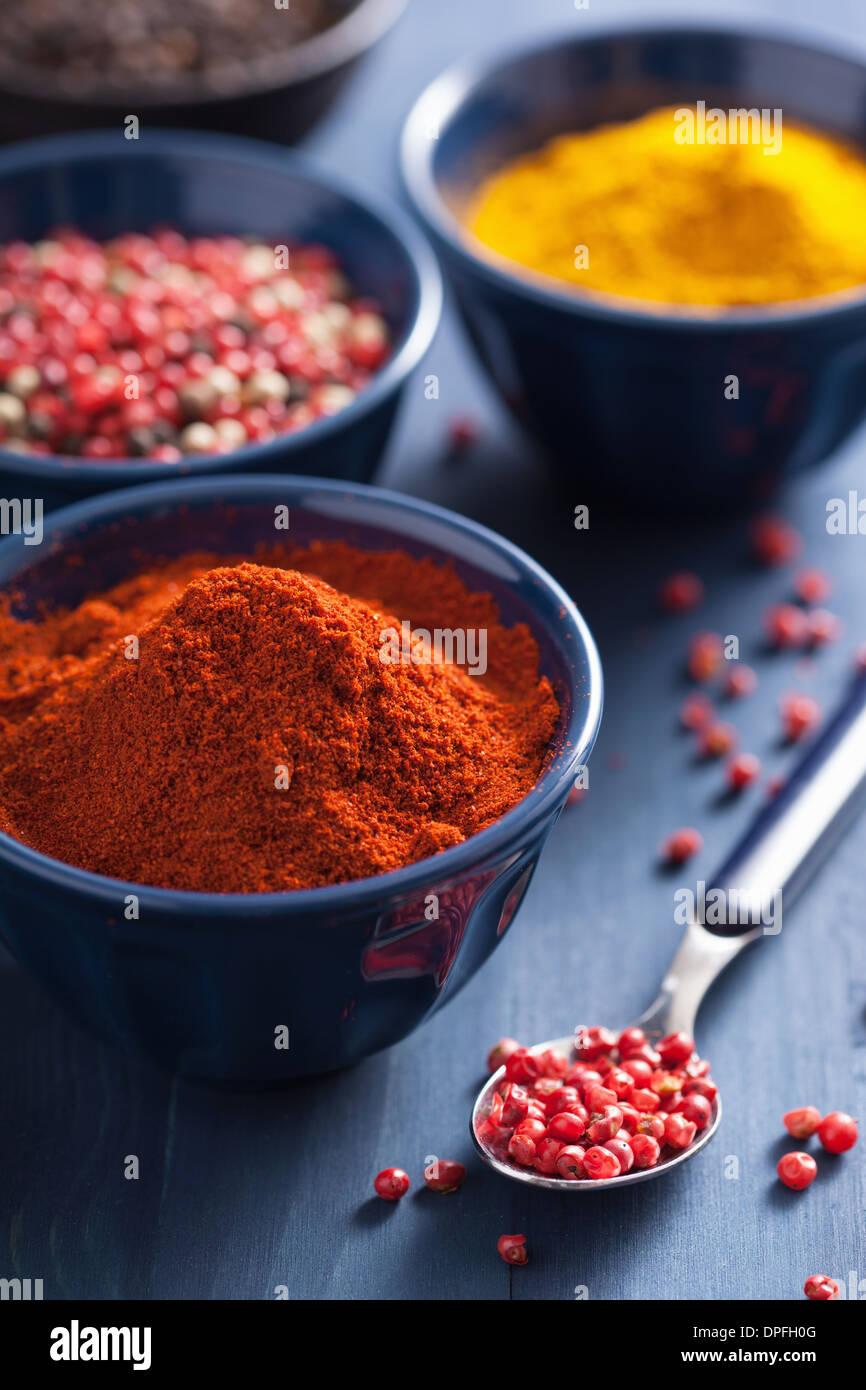 spices in bowls: curry, pink and black pepper, paprika powder Stock ...