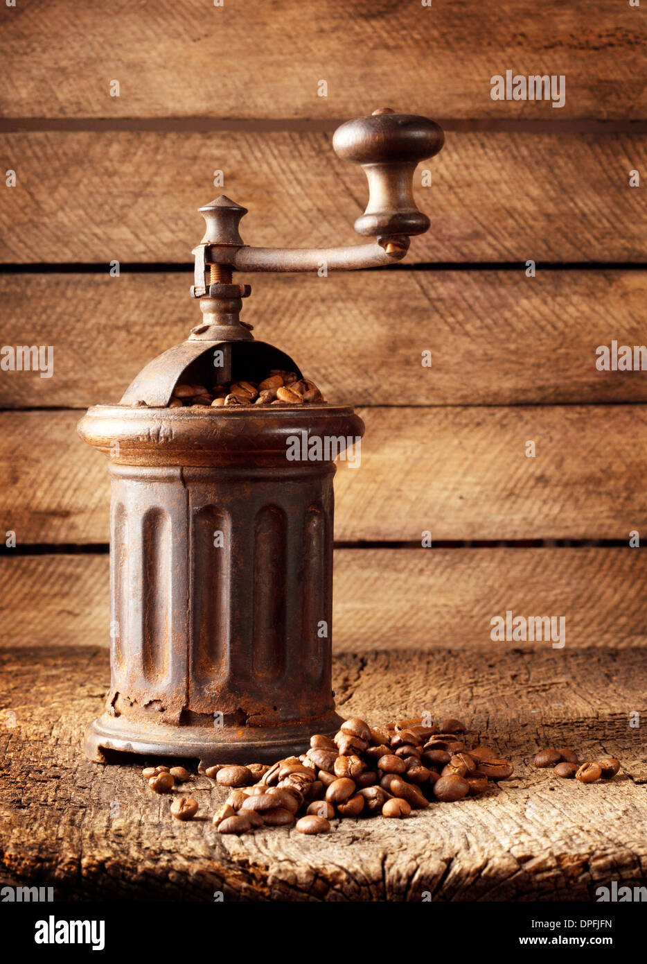 Old rusty coffee grinder with coffee beans Stock Photo - Alamy