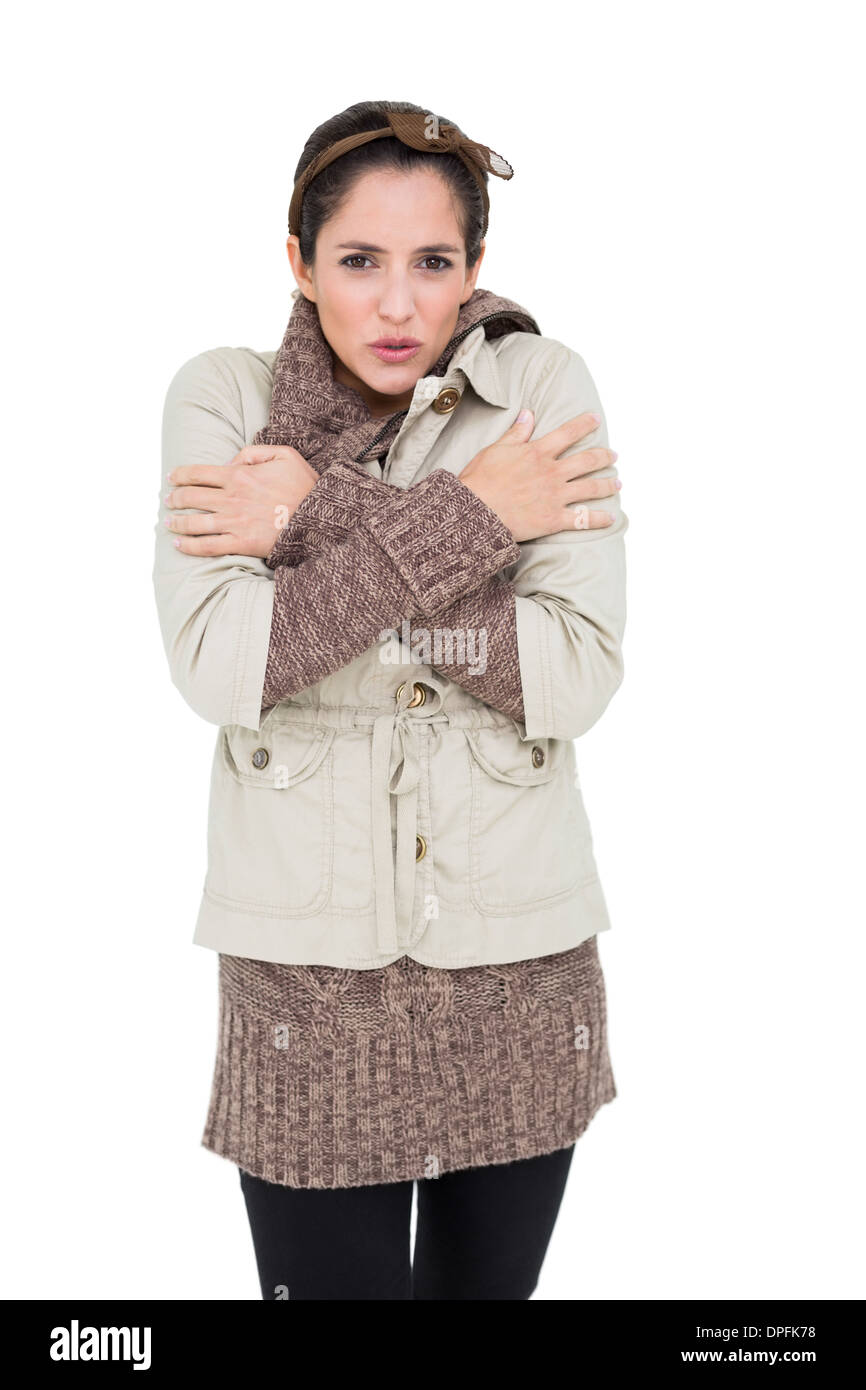 Freezing cute brunette in winter fashion looking at camera Stock Photo ...