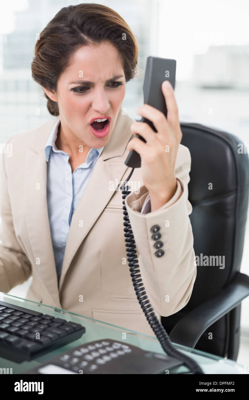 Frustrated businesswoman shouting at phone Stock Photo - Alamy