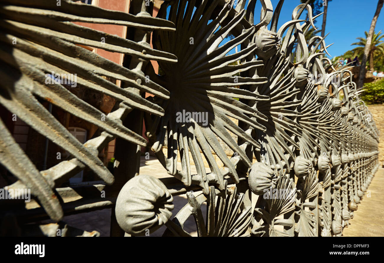 The iron gates, designed in the shape of palm leaves shape. Parc Guell ...