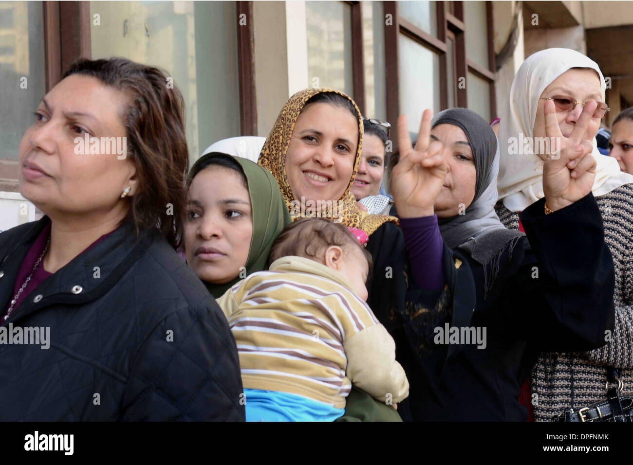 Cairo, Egypt. 14th Jan, 2014. Egyptians flash victory signs as they ...