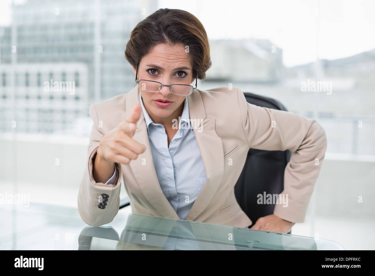 Irritated businesswoman looking at camera Stock Photo - Alamy