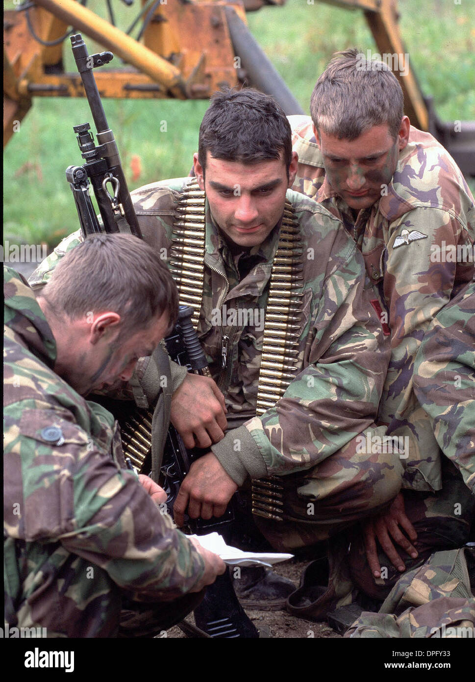 British solders with a GPMG - General Purpose Machine Gun and belts of ...