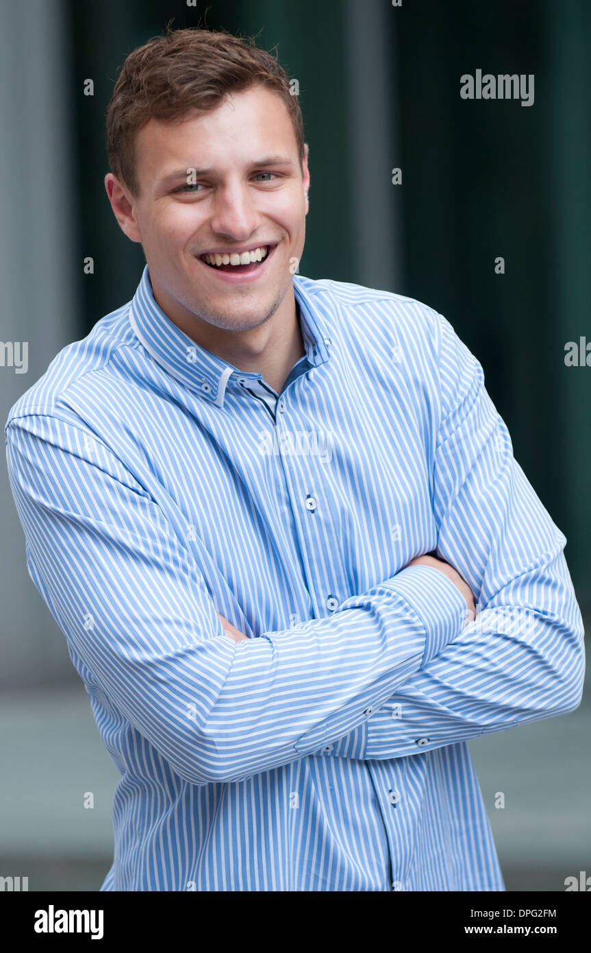 Young man smiling Stock Photo - Alamy
