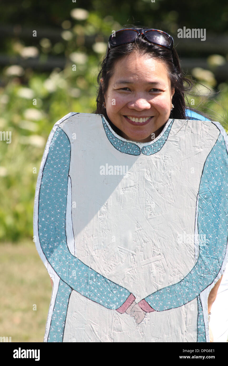 A woman’s face in the head space of a wooden cutout Stock Photo - Alamy