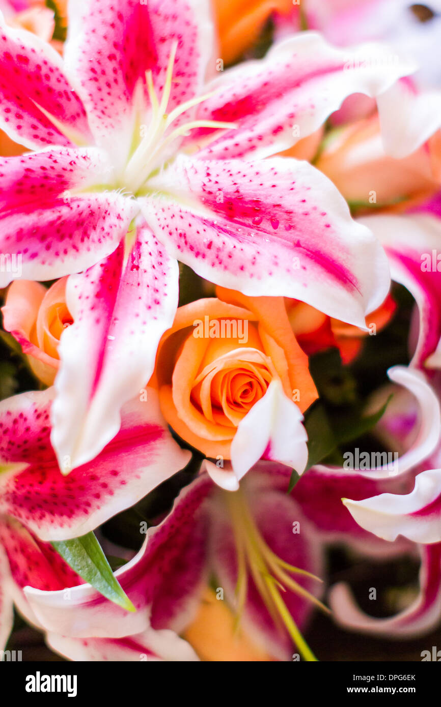 Wedding bouquet with pink lilies and orange roses Stock Photo - Alamy