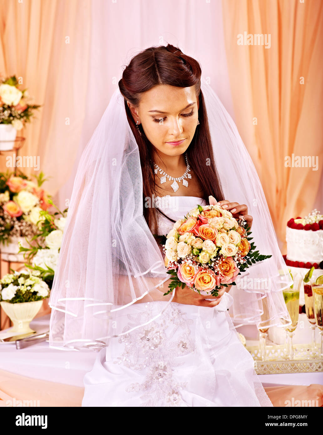 Sad bride at wedding table and cake Stock Photo - Alamy