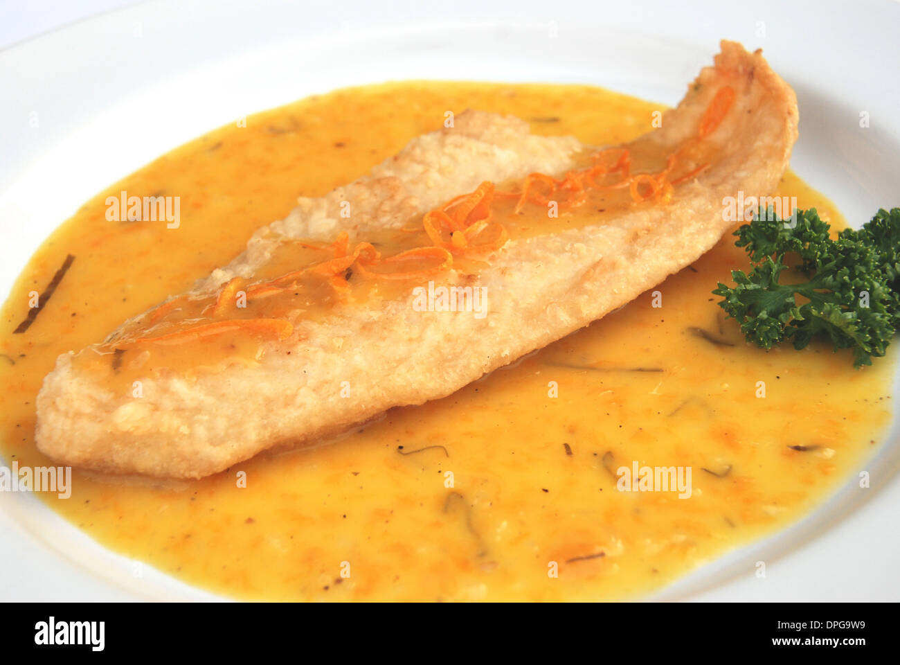 Fried Fish with orange sauce Stock Photo - Alamy