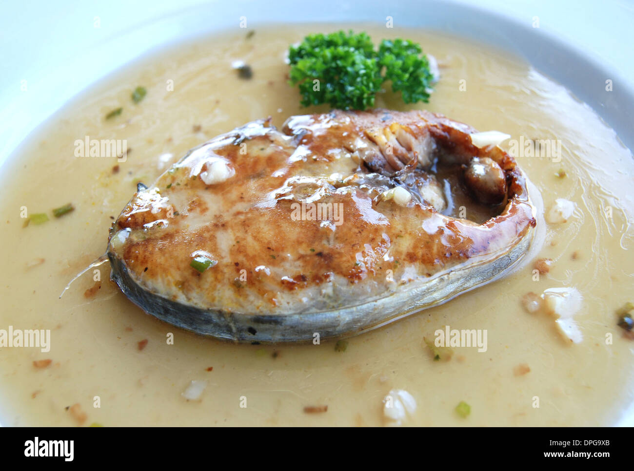 Fried King mackerel Fish with fish sauce Stock Photo - Alamy