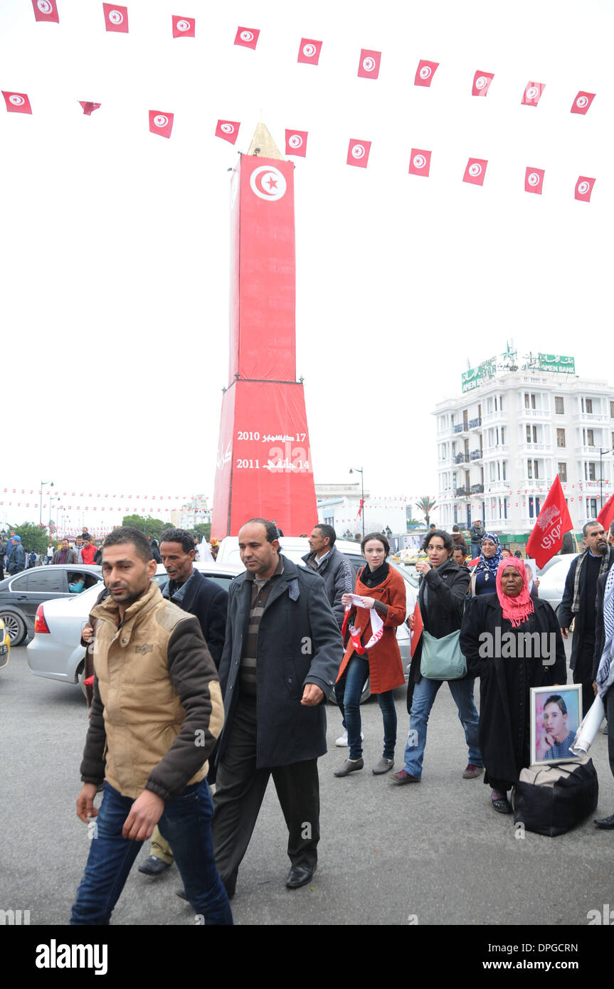 Tunis, Tunisia. 14th Jan, 2014. Tunisians take part in a rally marking ...