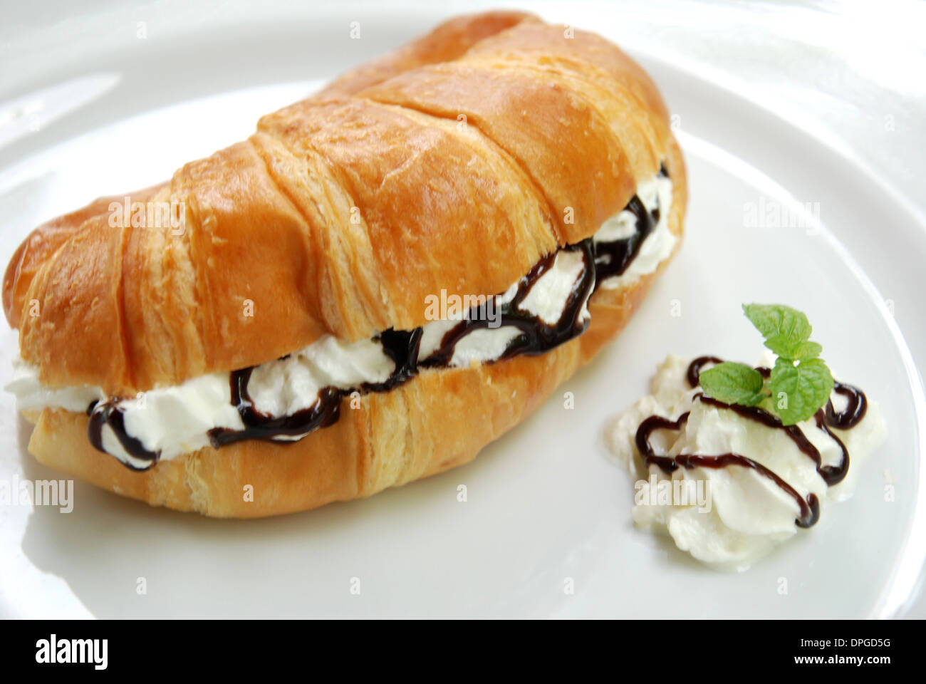 sweet fresh cream with croissant Stock Photo - Alamy