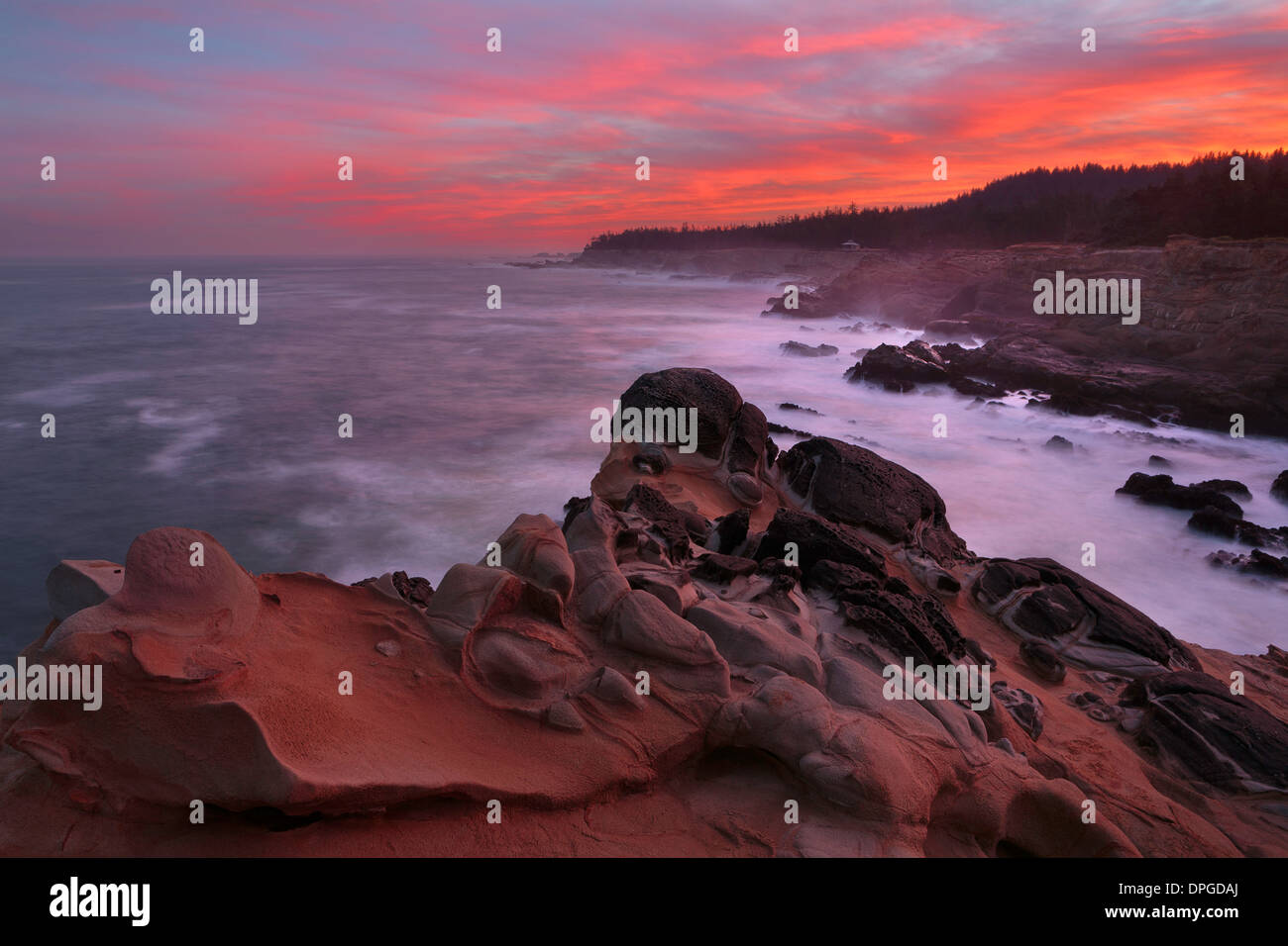 The dramatic Oregon coast line at sunrise along Shore Acres State Park ...