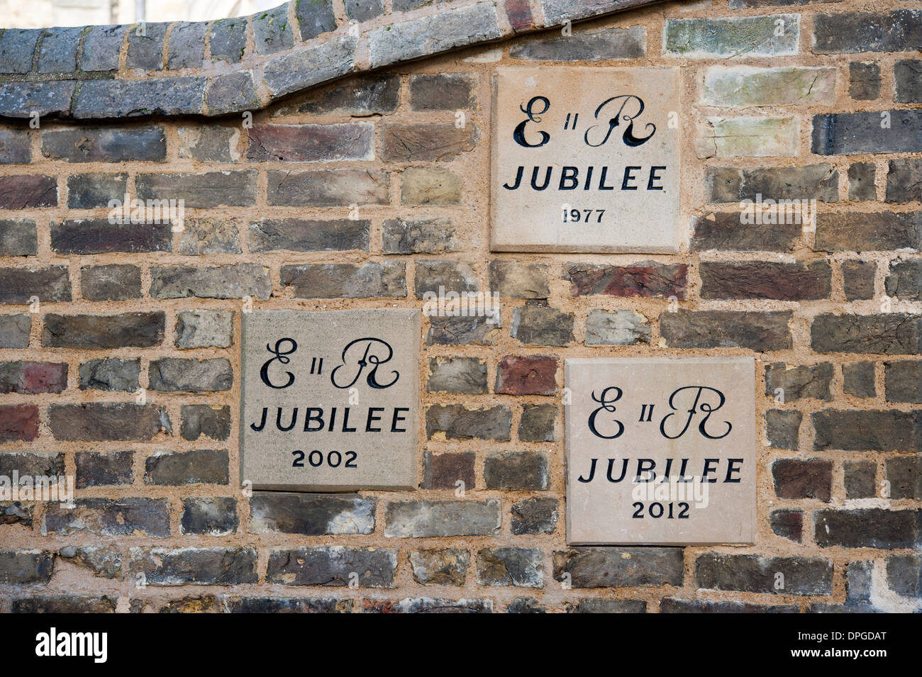 Masonry plaques in a wall in Willingham Cambridgeshire to commemorate ...