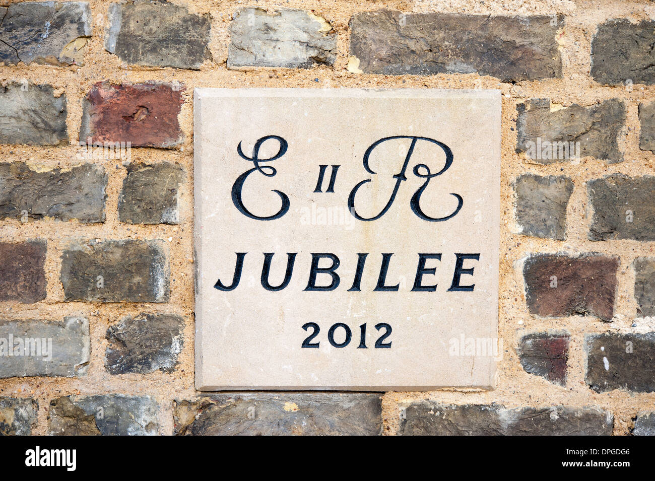 A masonry plaque in a wall in Willingham Cambridgeshire to commemorate ...