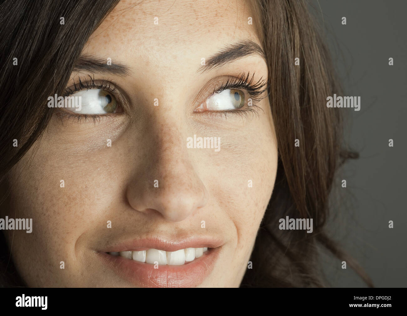 Young woman sly smile portrait hi-res stock photography and images - Alamy