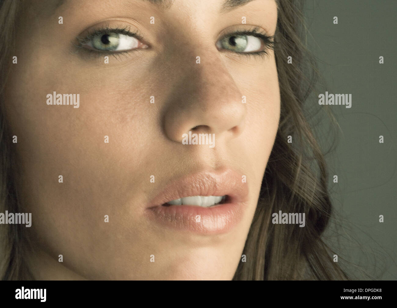 Young woman's face, looking at camera, portrait Stock Photo - Alamy