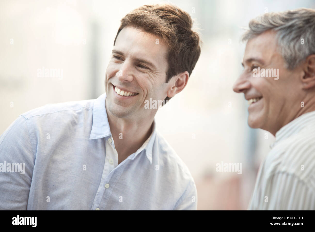Mid-adult man with friend Stock Photo - Alamy