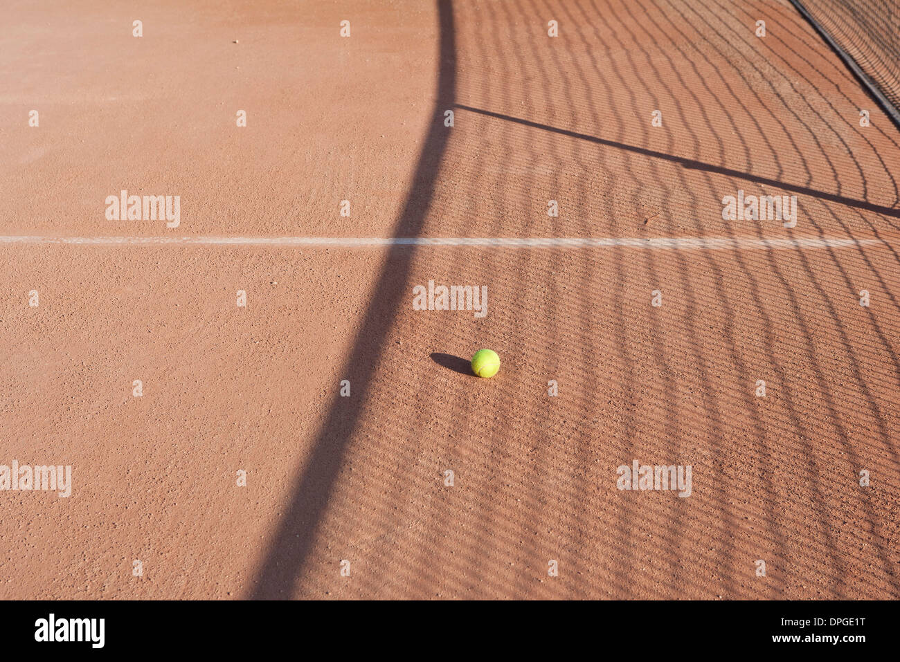 Shadow of net in tennis court over tennis ball Stock Photo - Alamy