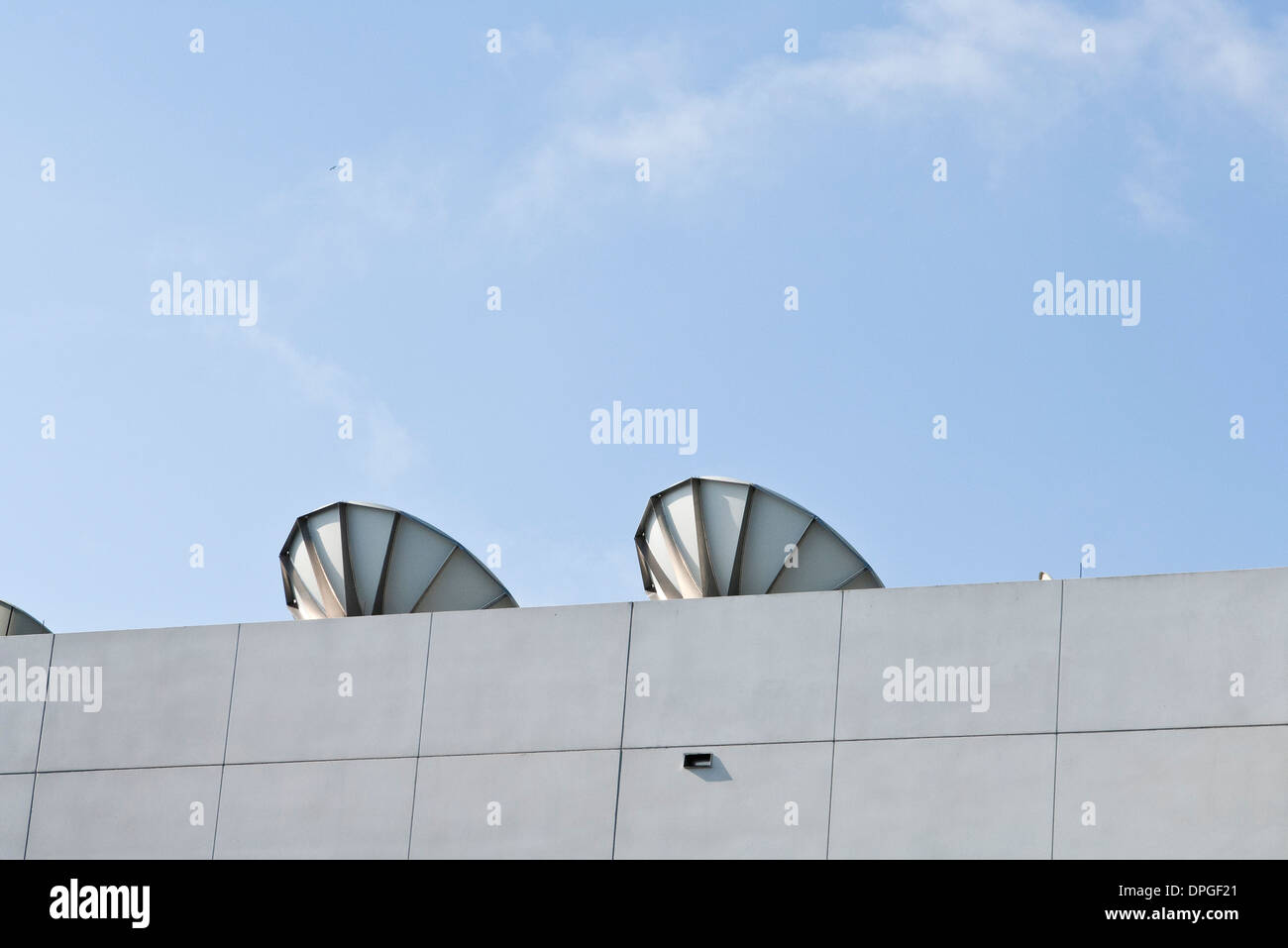 Satellite dishes on top of building Stock Photo - Alamy
