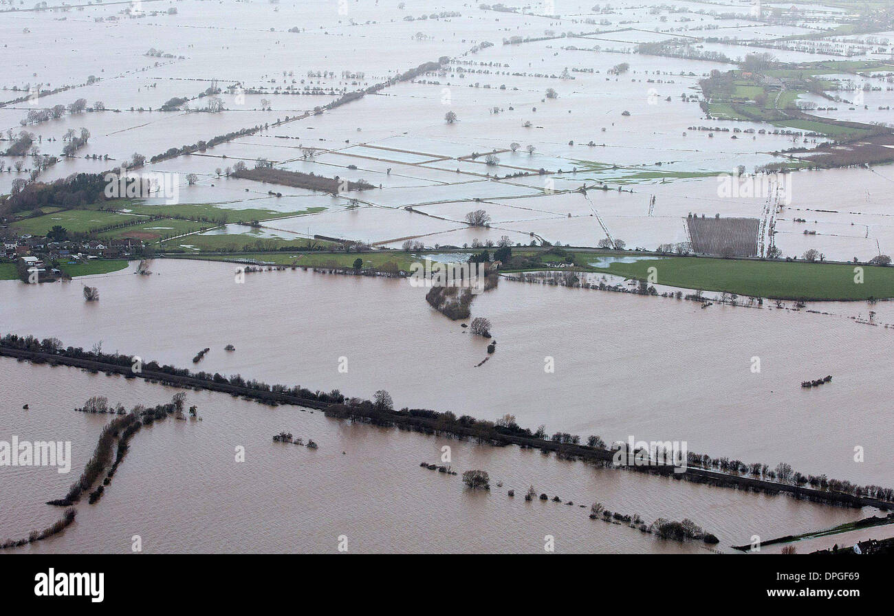 Aerial view of a house on the Somerset levels protected by a flood ...