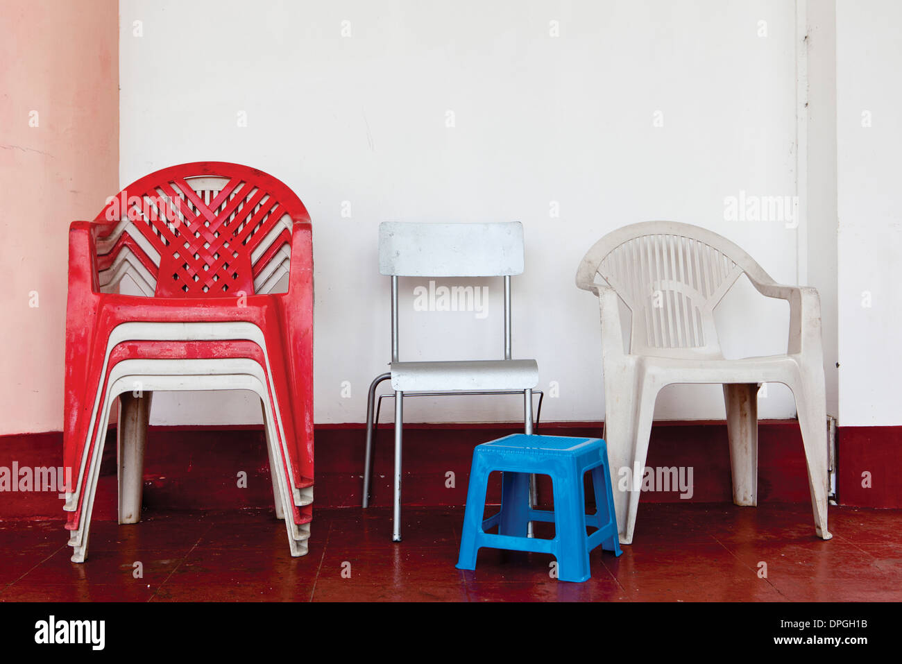 Stack of plastic chairs Stock Photo - Alamy
