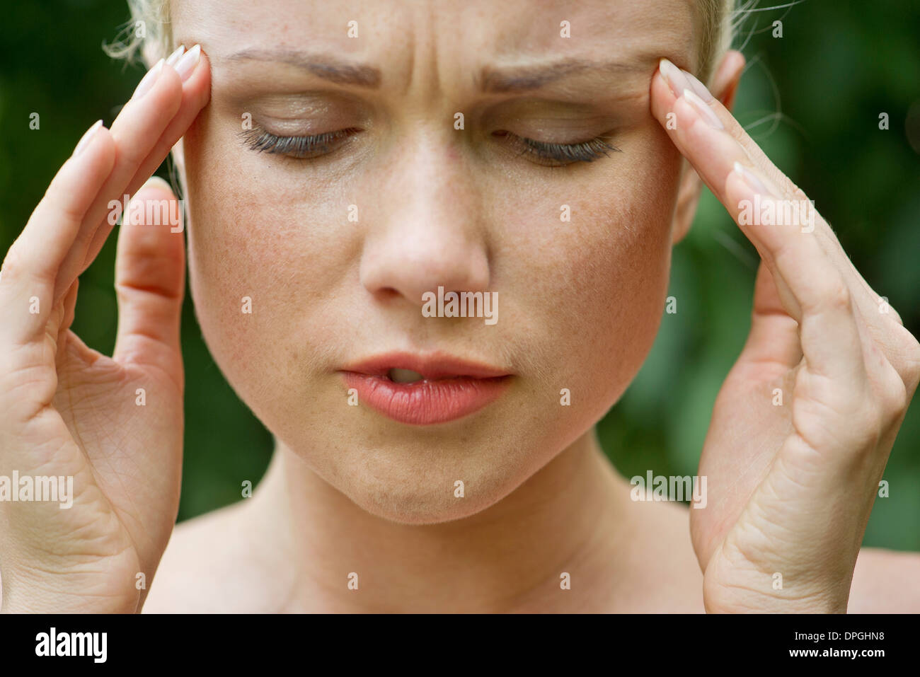 Close up ill person rubbing hi-res stock photography and images - Alamy