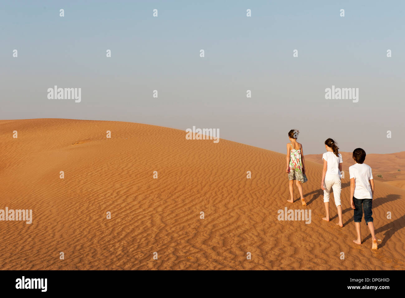 Children walking in desert, rear view Stock Photo - Alamy