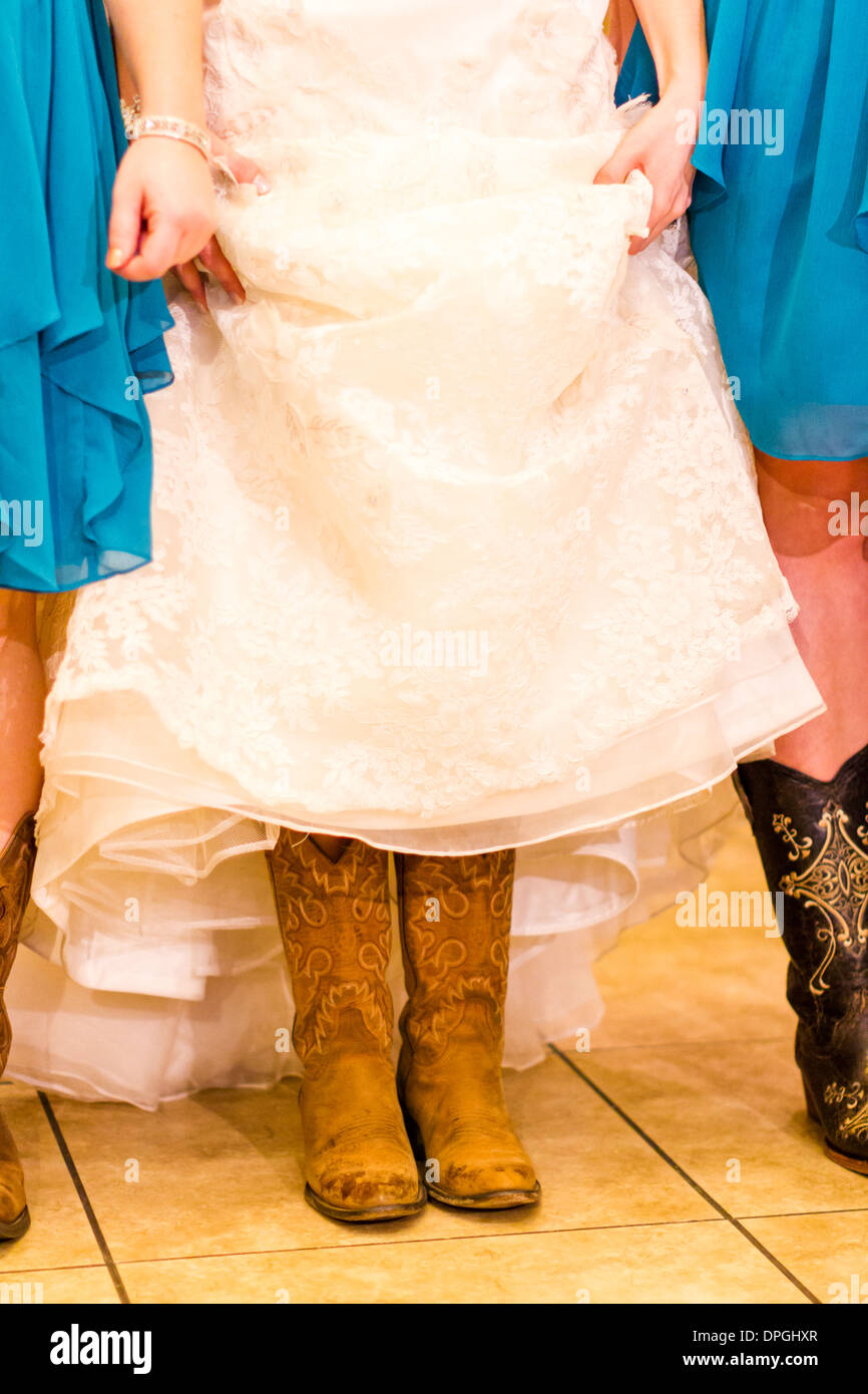 Young bride in cowboy boots before her wedding Stock Photo - Alamy