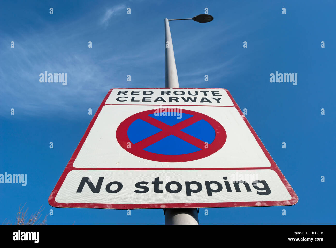 british road sign indicating a red route clearway with no stopping ...