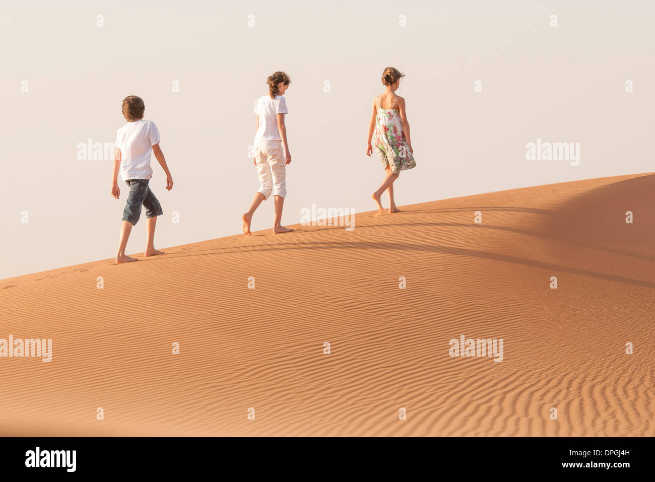 Children walking in desert Stock Photo - Alamy