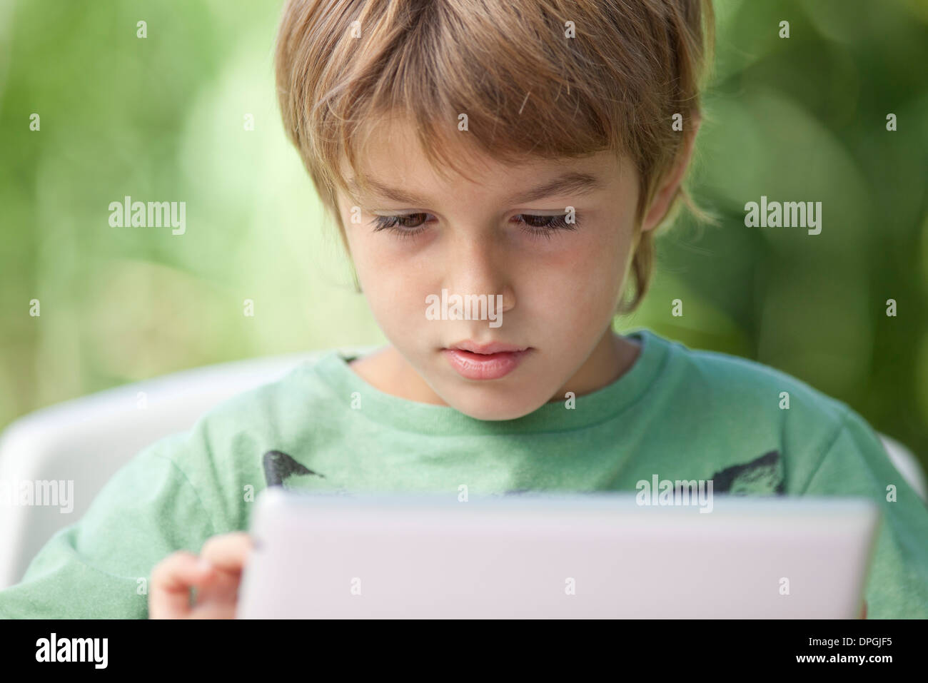 Boy using digital tablet Stock Photo - Alamy