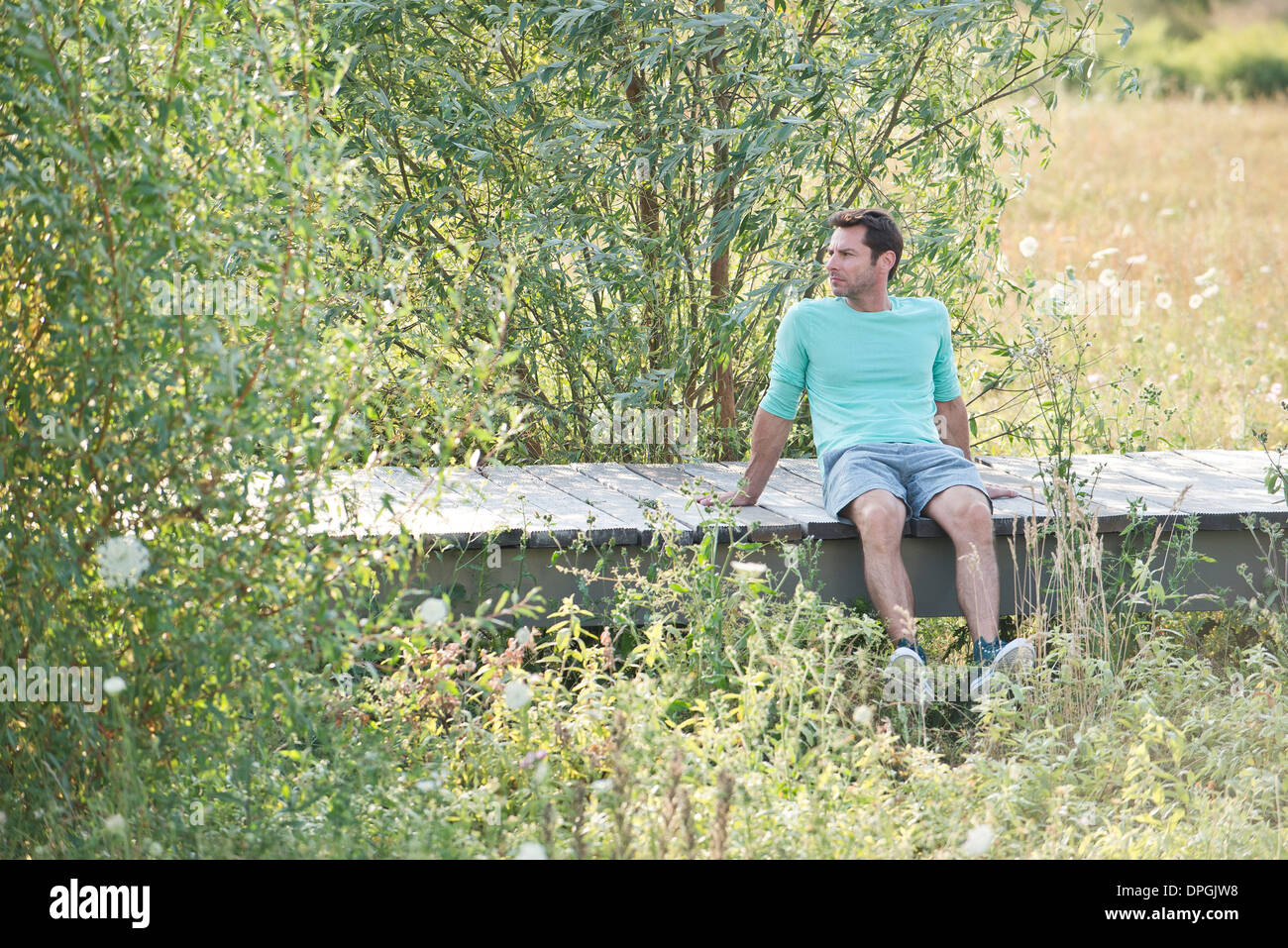 Man pausing to enjoy view on countryside walk Stock Photo - Alamy