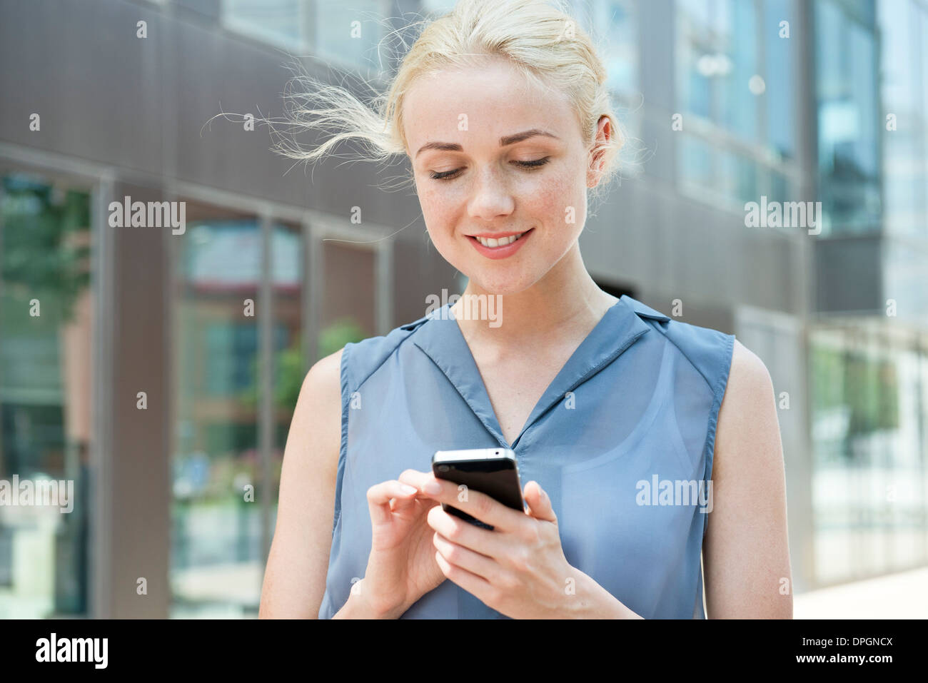 Young woman using smartphone Stock Photo - Alamy