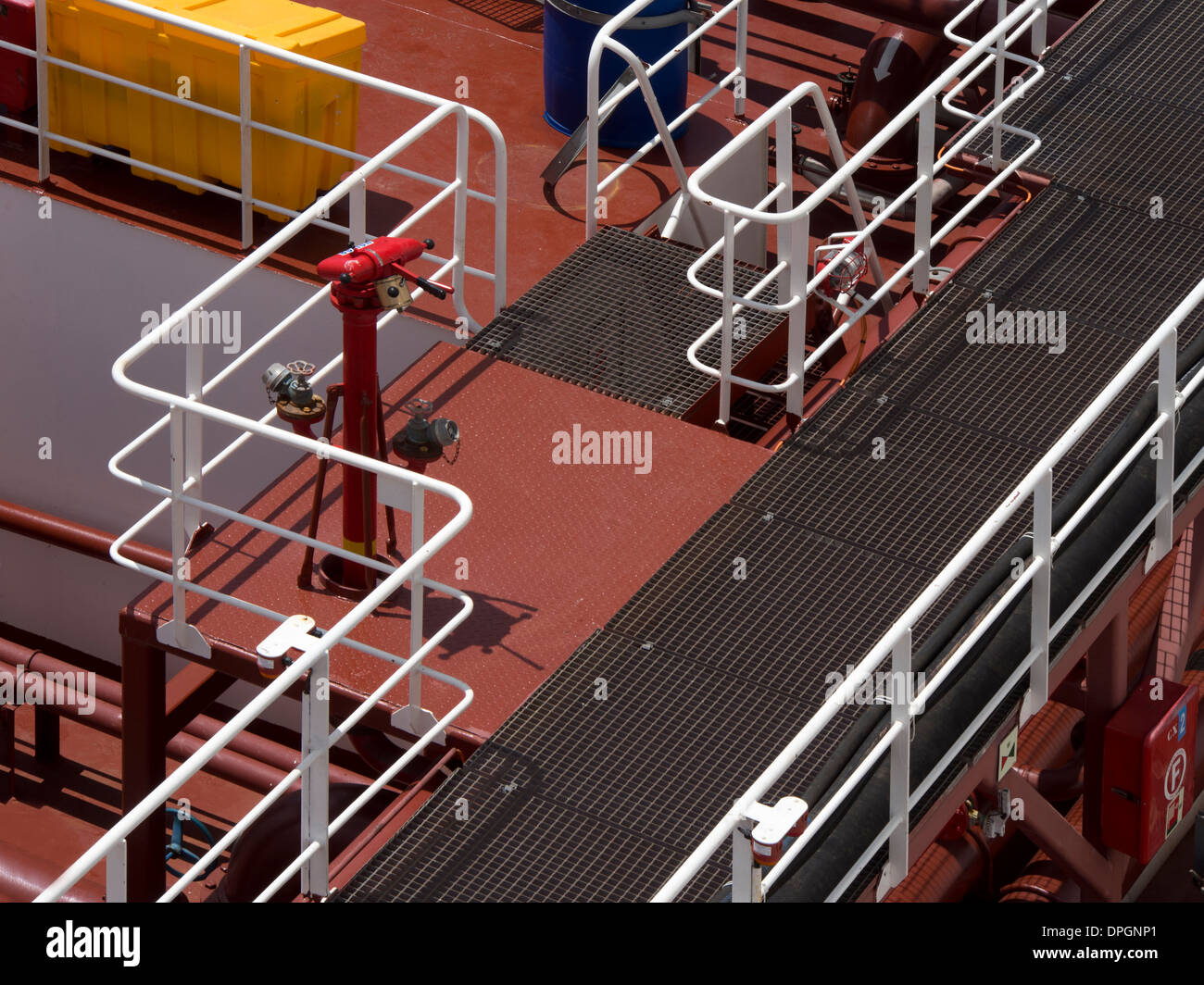 white railings and non-slip surfaces on the deck of a bunkering vessel ...