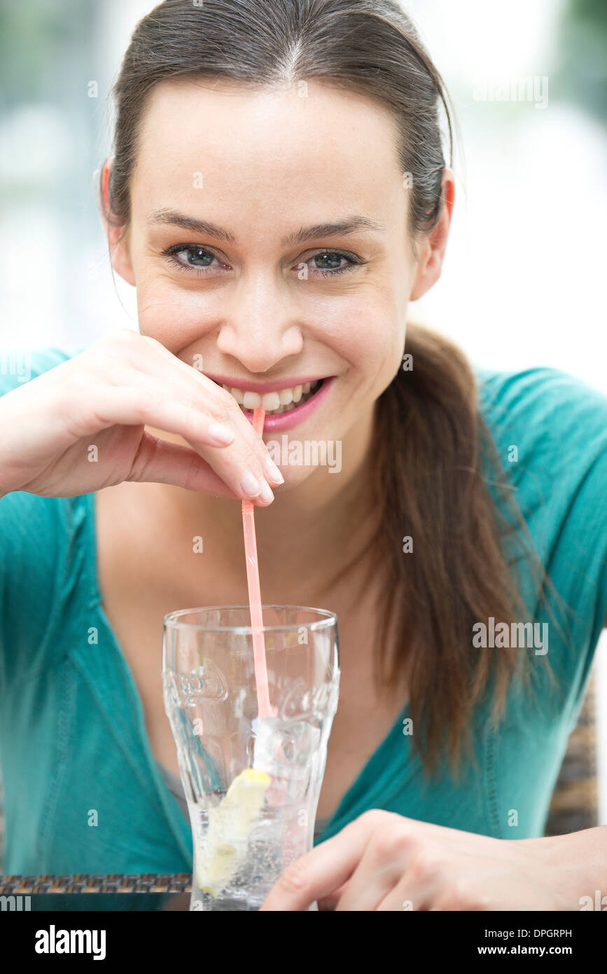 Woman glass straw mid view hi-res stock photography and images - Alamy