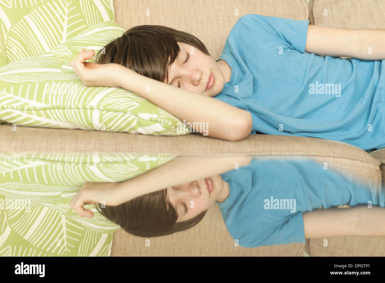 Teenage boy napping on sofa Stock Photo - Alamy