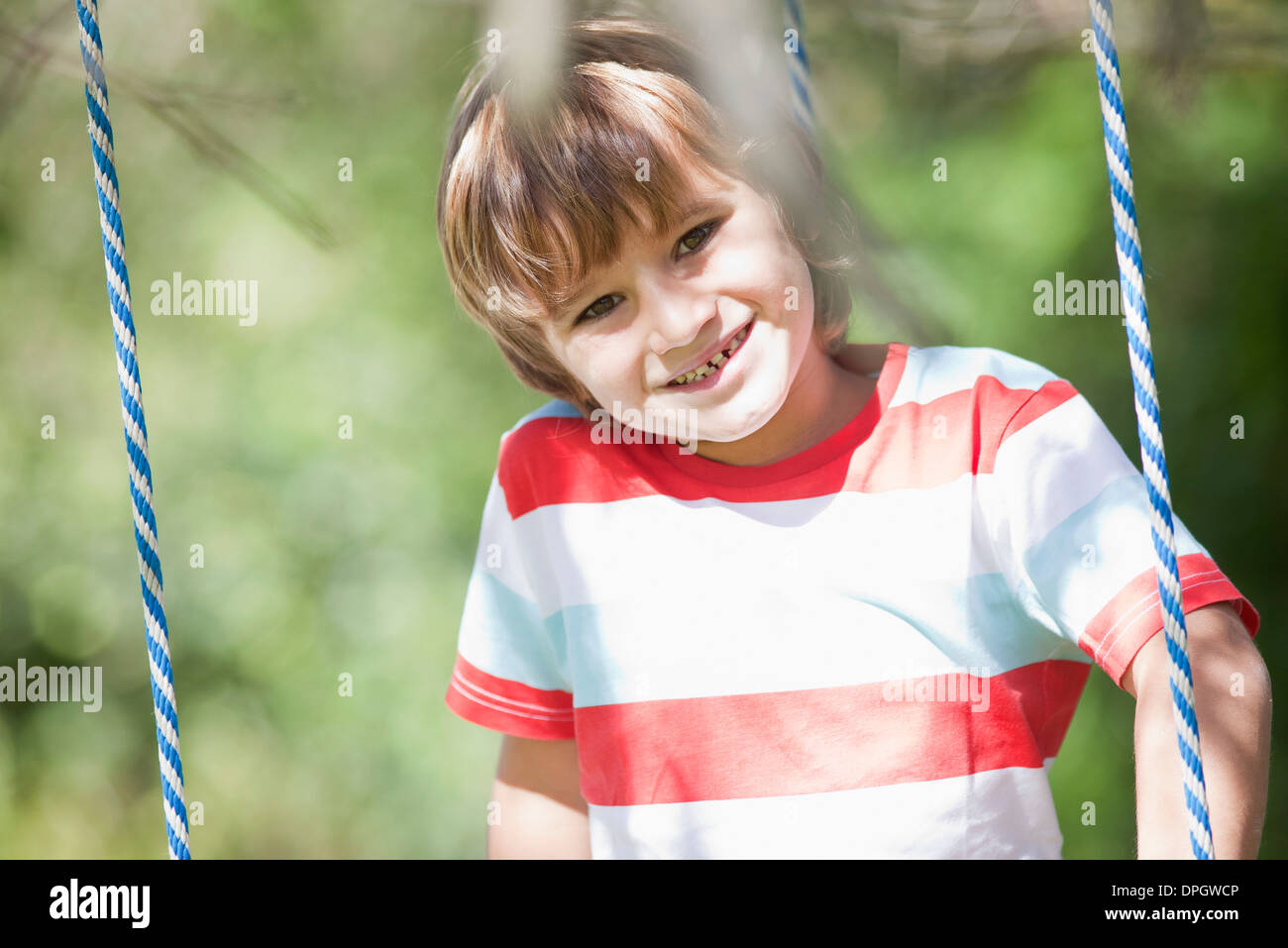 Boy 6 7 on swing hi-res stock photography and images - Alamy
