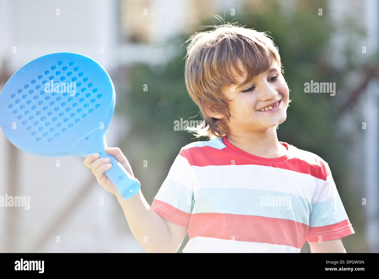 Boy holding racket Stock Photo - Alamy
