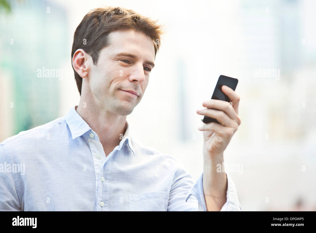 Front view man checking messages hi-res stock photography and images ...