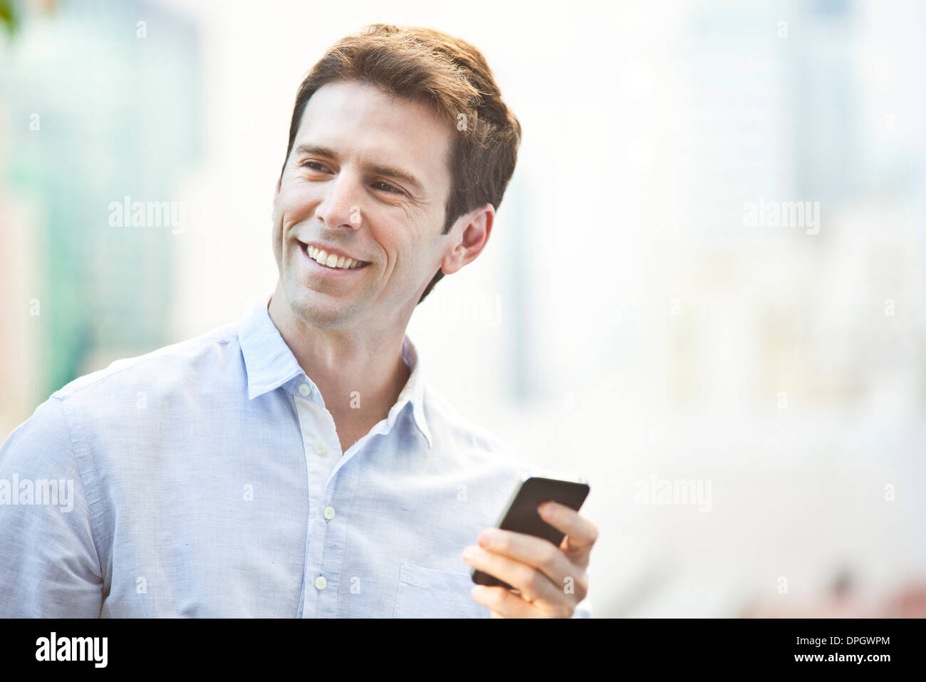 Handsome businessmen using phones hi-res stock photography and images ...
