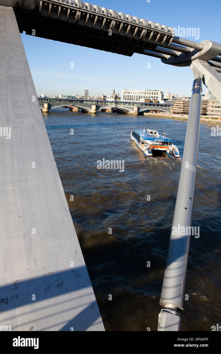 Thames Clipper through the Millennium Bridge, River Thames, London ...